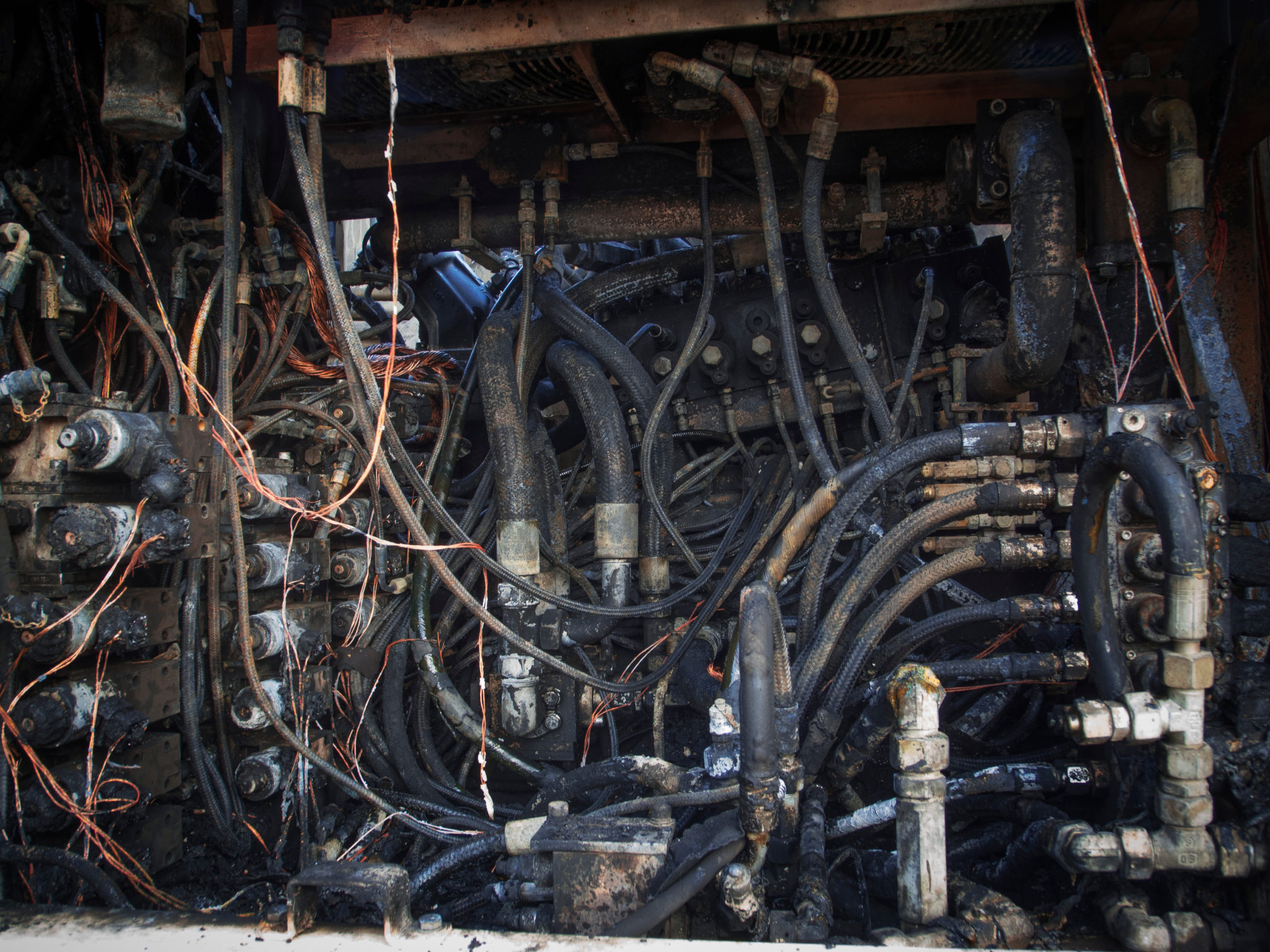 Heavy Machinery Fires Caused by Hydraulic Hose Failures | Warren Forensics